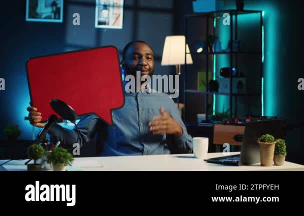 Influencer filming sponsored content, holding empty copy space sign in ...