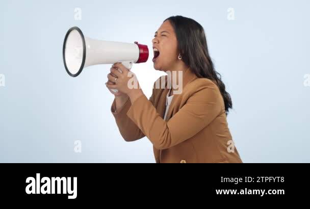 Angry asian woman, megaphone and screaming in protest, voice or ...