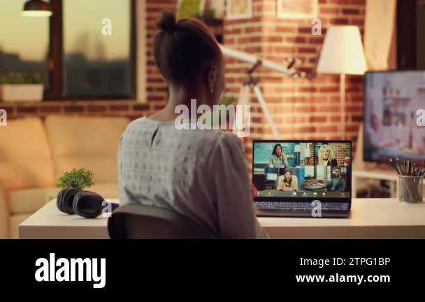 Woman meeting with clients on videocall, explaining price list and ...
