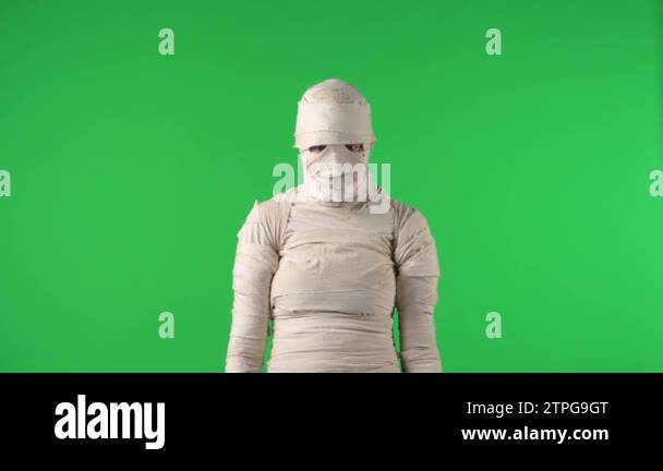 Green screen isolated chroma key video capturing a creepy mummy raising ...