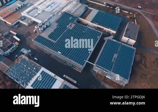 Innovative solar farm on roofs. Blue solar panels on the top of ...