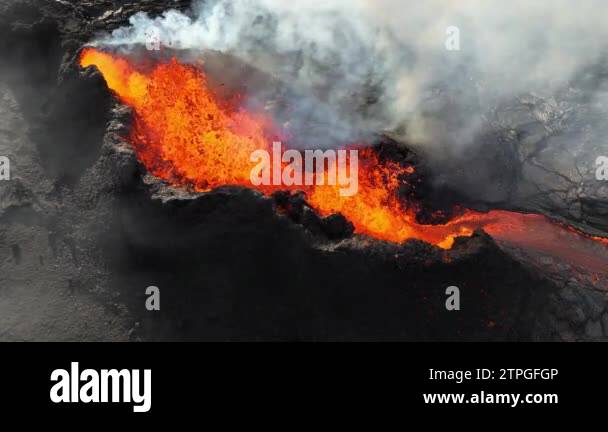 Volcano eruption in 2023, Red burning lava erupts from the ground in ...