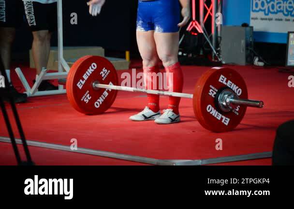 Weightlifter woman during a powerlifting championship in a dead lift ...