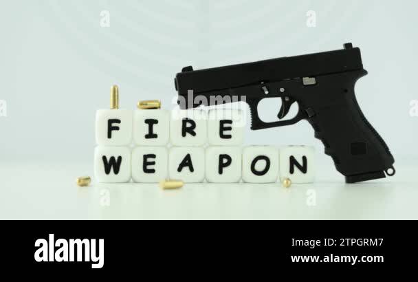 Automatic handgun with golden bullets near phrase Fire Weapon on light ...