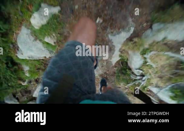 Top down point of view shot, man hiking on path and climbing mountain ...
