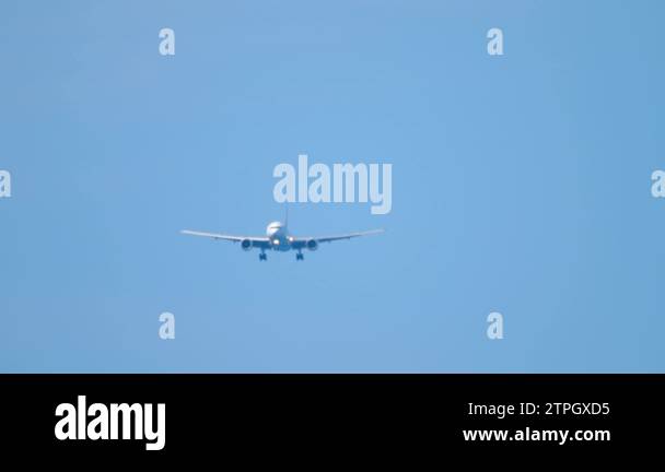 Front view of jet passenger jet plane in the blue sky. Airliner ...