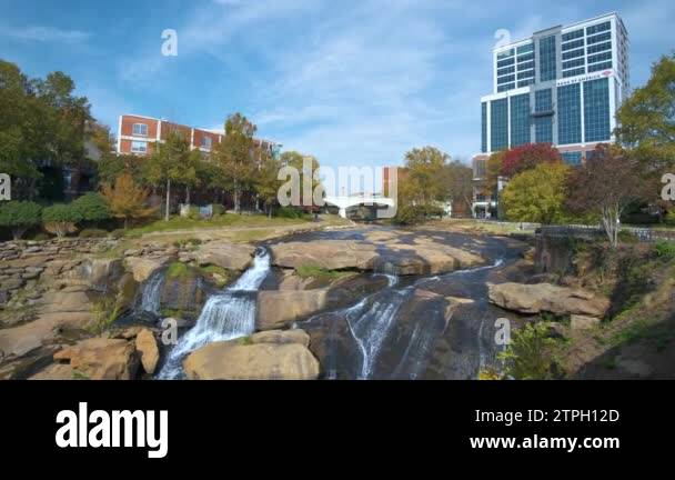 Reedy River Waterfalls in downtown of Greenville city in South Carolina. Falls Park Riverwalk at ...