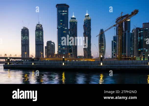 Sunset till night panoramic view of Business bay, reflection of the ...
