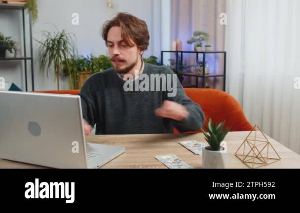 Planning budget. Rich happy man counting money cash use laptop computer ...