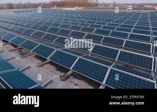 Rows of photovoltaic panels on a flat roof. Huge territory on the top ...