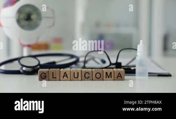Glaucoma written on background of glasses for vision and eye drops ...