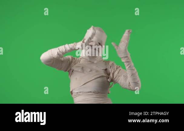 Green screen isolated chroma key video capturing a mummy shaking arms ...