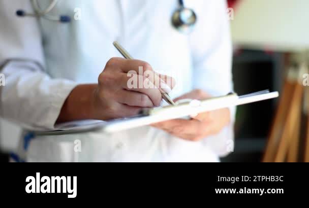 Female doctor nurse practitioner writing patient information ...