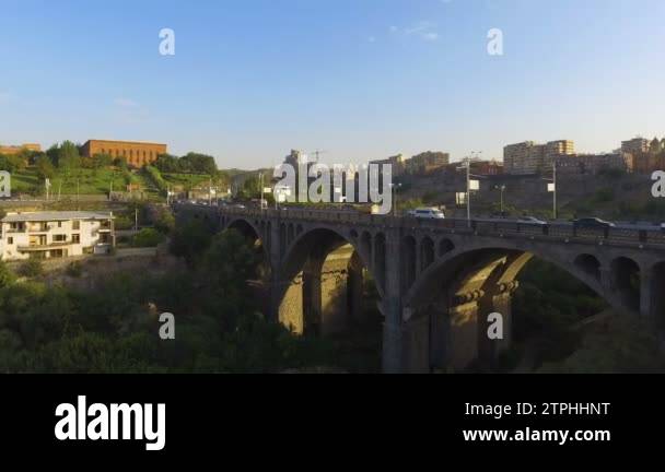 Busy traffic on ancient Victory Bridge in heart of Yerevan, river ...