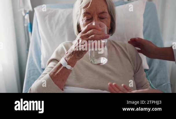 Sick, care and woman drinking water in a hospital after a surgery ...
