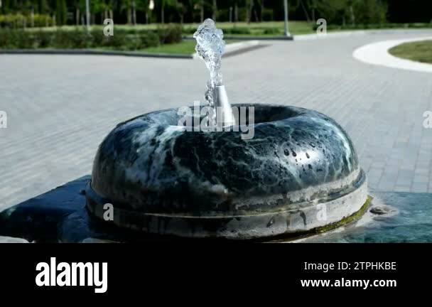 Water flows from the drinking water fountain. Square in front of Sameba ...