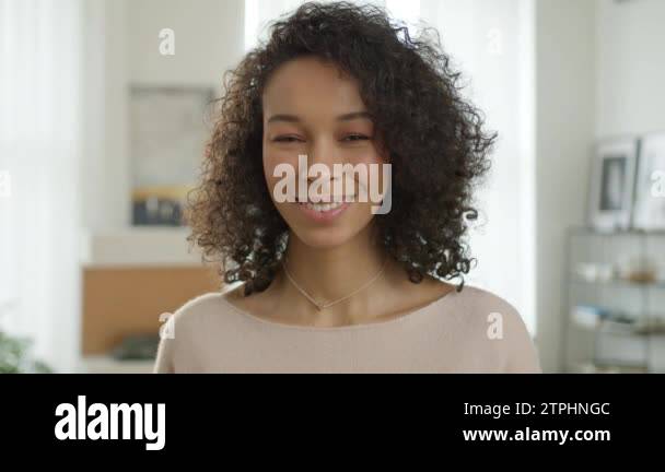 Attractive multi ethnical woman smiling on motion background 4K ...