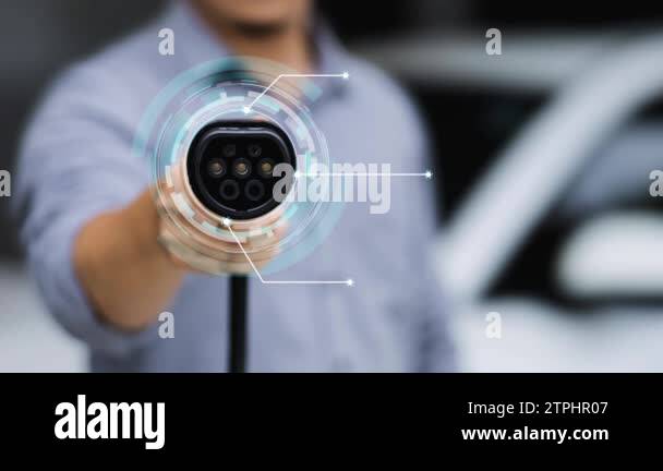 Focus EV charger pointing in front of camera display futuristic smart ...