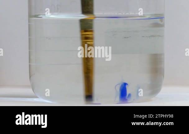 Diffusion of Blue Dye in a Glass of Water. Slow Motion Stock Video ...