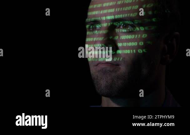 Close Up Of An Adult Hacker With Beard Working At A Computer While