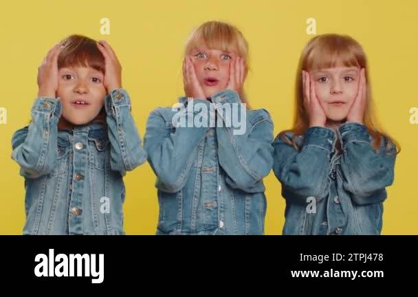 Oh my God, Wow. Little child sisters looking surprised at camera with ...