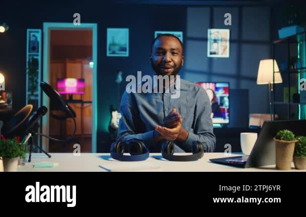 African american content creator filming video review of noise ...