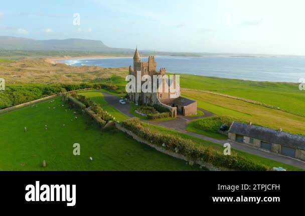 Spectacular aerial orbit sunset view of Classiebawn Castle and ... Spectacular aerial orbit sunset view of Classiebawn Castle and ...