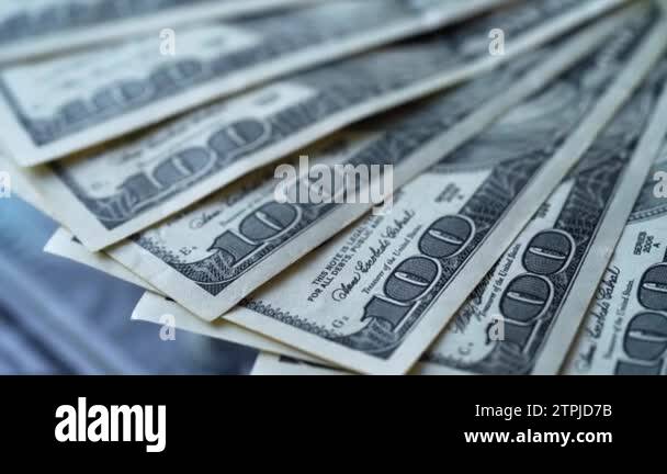 Hundred dollar bills spinning. Rotation of paper money. Background with ...