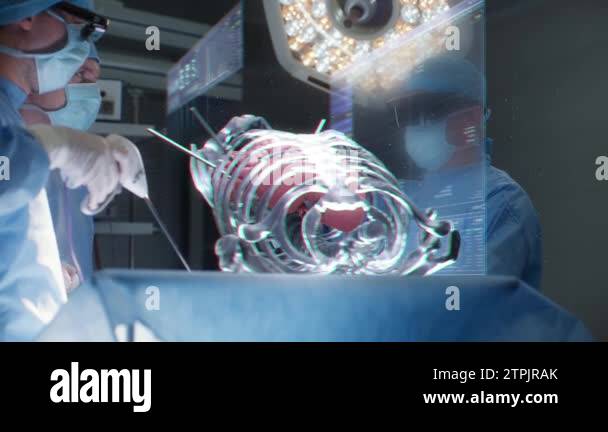 Surgeons perform laparoscopy operation in hospital surgery room wearing ...