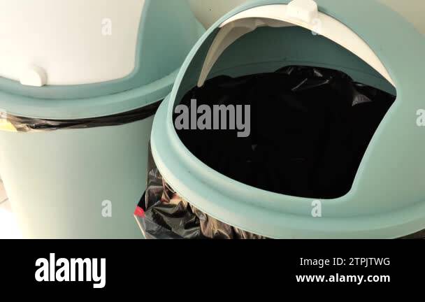 Garbage sorting.Paper trash. Sorting paper for recycling.hand throws ...