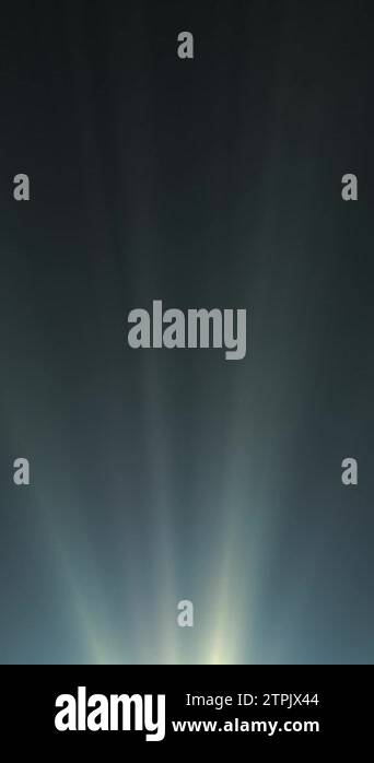 Looped animated blue light rays on dark background in vertical ...