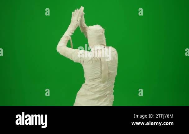 Green screen isolated chroma key video capturing a mummy dancing with ...