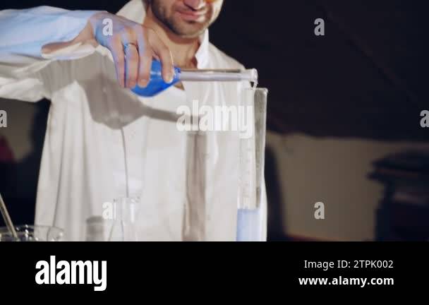 Technician mixing two chemical substances liquid Stock Videos & Footage ...