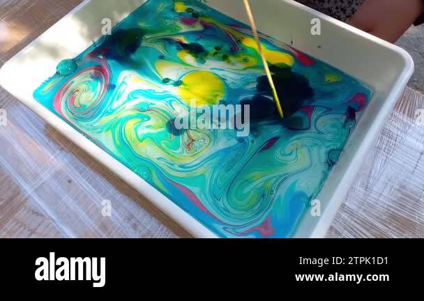 Lesson on drawing technique Ebru. child drawing, mixing paints ...