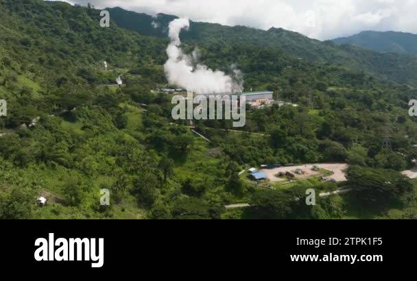 Geotermal power plant in the mountains. Geothermal station with steam ...