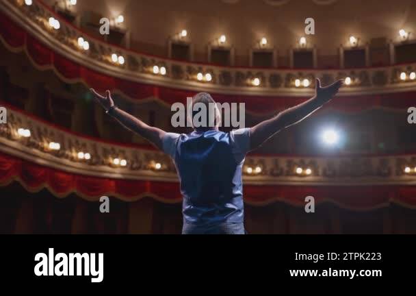 Man performing with gestures on stage. Unrecognizable actor standing on ...