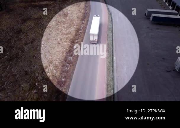 Aerial Shot of Truck with Attached Semi Trailer Leaving Industrial ...