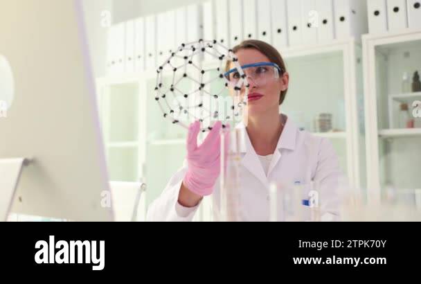 Scientist chemist and round molecule in chemical laboratory. Methods for studying structure of ...