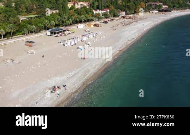 Drone shooting of the beach, the black sea, the city of Gagra, white ...