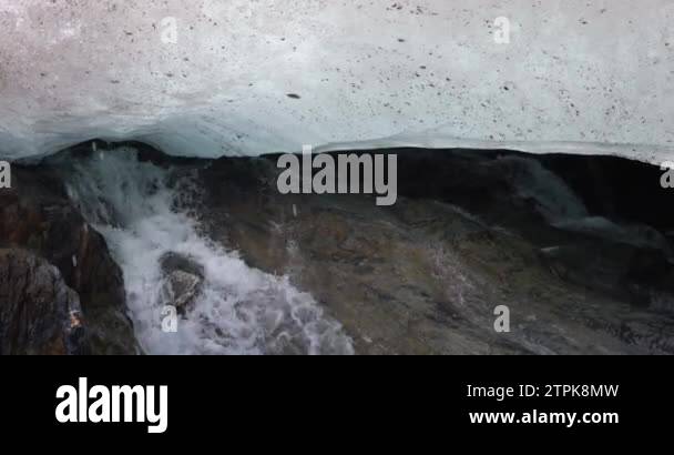 Melting glacier subterranean water streams inside the glacier cave ...