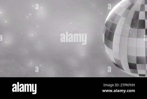 Animation of mirror disco ball spinning over spots of lights on grey ...