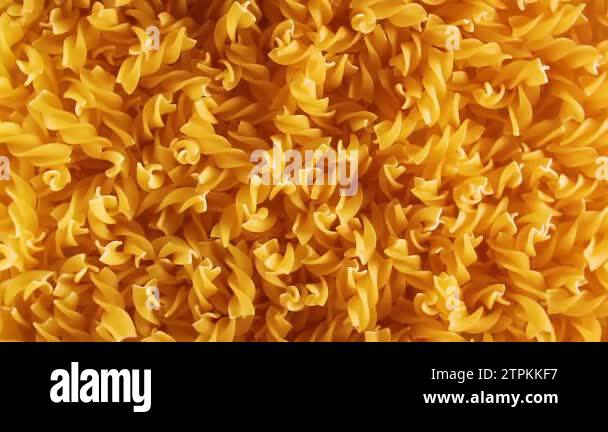 Uncooked Fusilli Pasta - Top View. Fat and Unhealthy Food. Dry Spiral ...