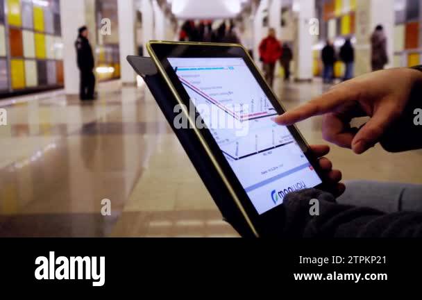 Man in underground examines the subway map using the tablet Stock Video ...
