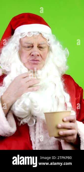 Actor in role of Santa Claus takes off his beard and eats noodles ...