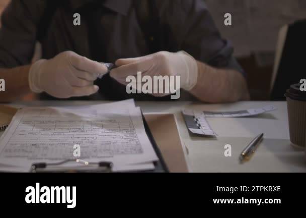 Evidence examination Stock Videos & Footage - HD and 4K Video Clips - Alamy