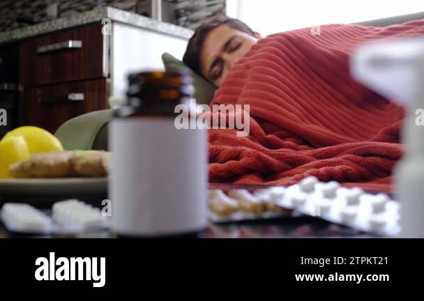 Ginger, lemon, onion and different drugs on table on background sick ...