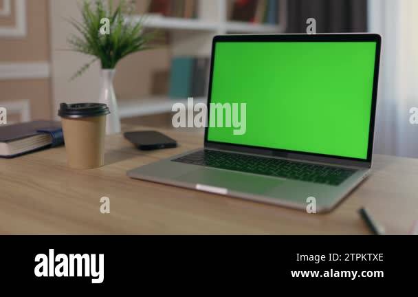 Laptop With Green Mock-up Screen On Desktop In Cozy Home Office. Chroma ...