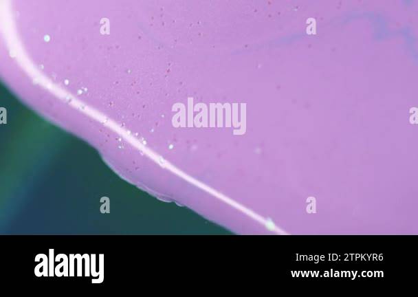 Glitter fluid. Paint flow. Enamel drip. Defocused shiny shimmering ...