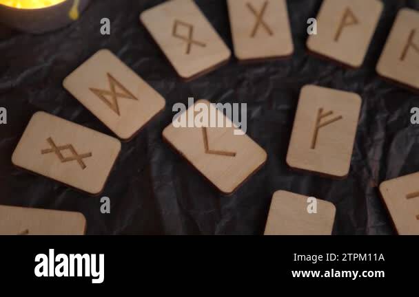 Wooden rune wheel. runic layout and candles, 4k, slow-motion shooting ...