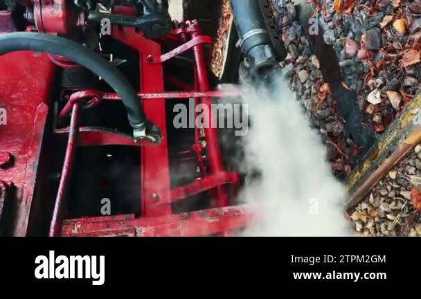 Close up of pipe of old German coal engine train releasing thick clouds ...